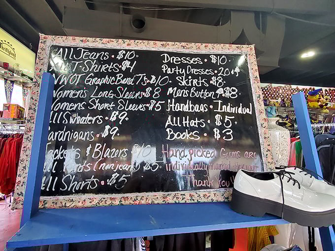 Bargain blueprint! This handwritten price board reveals the method behind the madness—where $3 books and $10 dresses make Disney dreams affordable again.