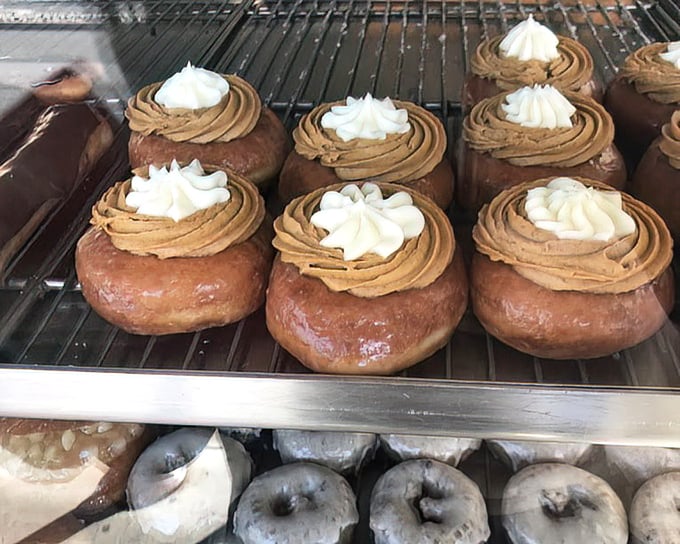 These cream-topped confections aren't just donuts—they're edible architecture with structural integrity that would impress Frank Lloyd Wright.