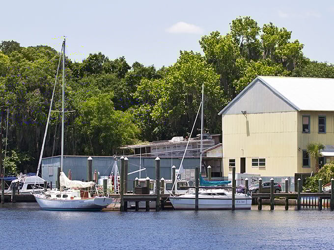 Sailboats rest peacefully at this riverside marina, where the pace slows down and "boat time" becomes the only schedule worth following.