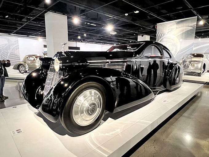 This magnificent black Rolls-Royce embodies automotive royalty. It doesn't just park—it arrives, making an entrance worthy of old Hollywood glamour.
