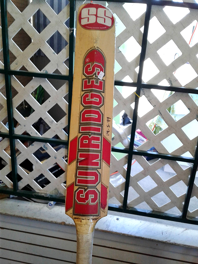 That vintage Sunridges cricket bat isn't just sporting equipment—it's a conversation piece waiting to confuse your American friends about the rules of cricket.