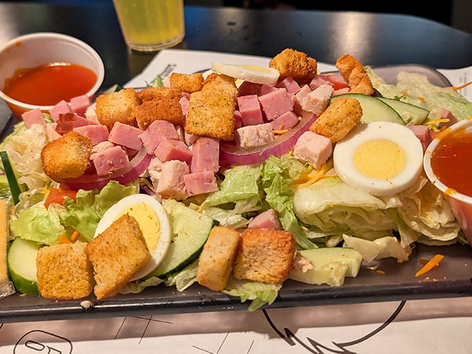 A salad that doesn't apologize for being a salad – it's brought reinforcements of ham, egg, and croutons to the flavor party.