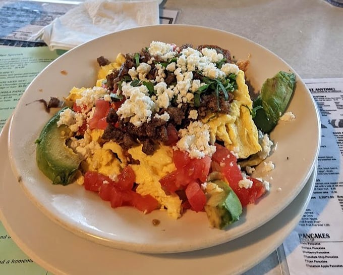 Breakfast geography at its finest—mountains of eggs, valleys of avocado, and a sea of flavors that'll make your taste buds want to explore.