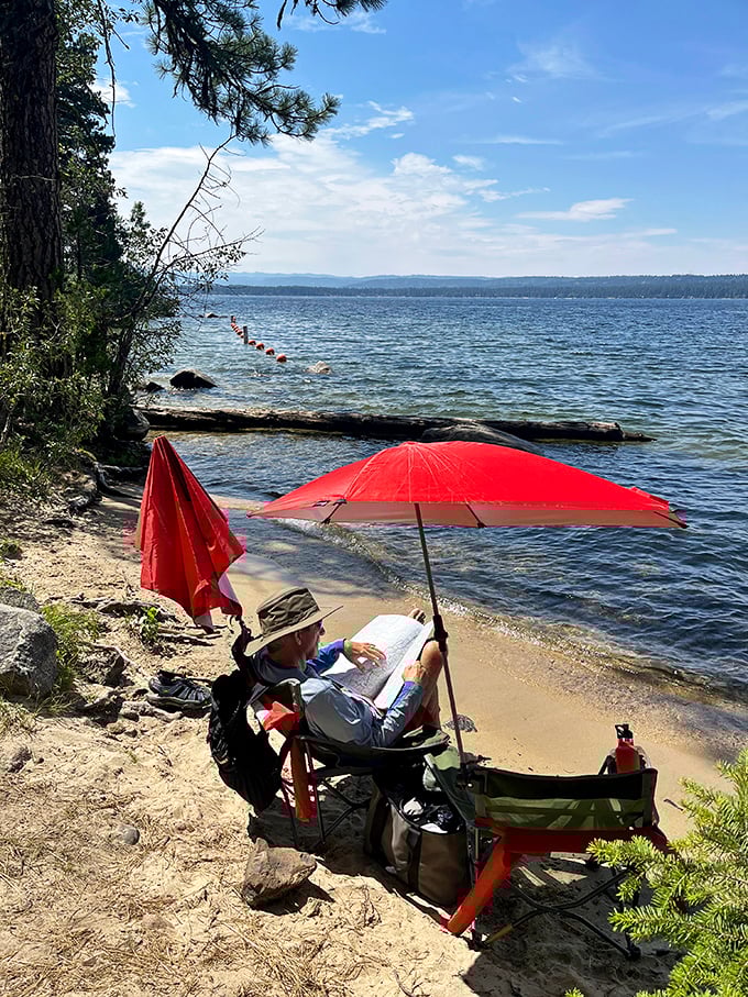 The perfect reading nook doesn't exi— Oh wait, here it is. A good book, lake views, and an umbrella for optimists in the Northwest.