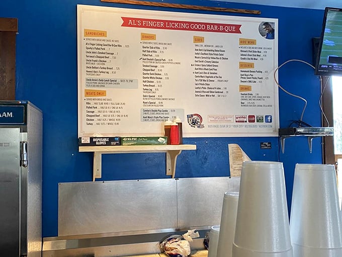 The menu board isn't just informative—it's a hall of fame where barbecue legends are immortalized in white lettering and reasonable prices.