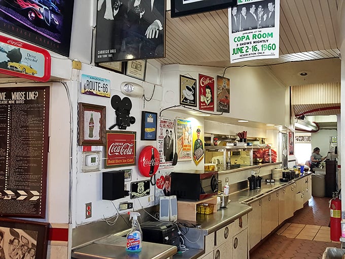 The walls serve as a museum of Americana – where Route 66 memorabilia, vintage ads, and Hollywood icons create a timeline of nostalgic treasures.