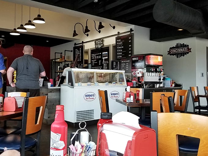 The Cincinnati skyline silhouette watches over diners like a proud parent—local pride served alongside smoky delights.