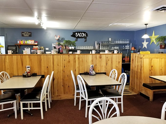 Blue walls, wooden wainscoting, and a sign that simply says "BACON"—because sometimes the most important things need the least explanation.