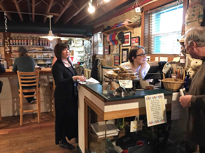 Staff working the counter managing the morning rush with smiles intact—these are the unsung heroes making your cinnamon roll dreams come true daily.