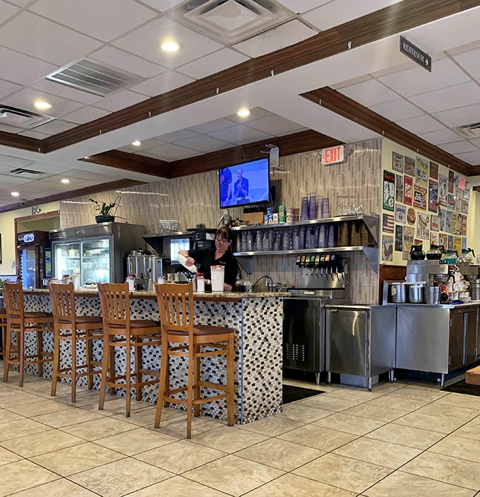 Behind this counter, culinary magic happens without fanfare—just the quiet confidence of people who know what you need before you do.