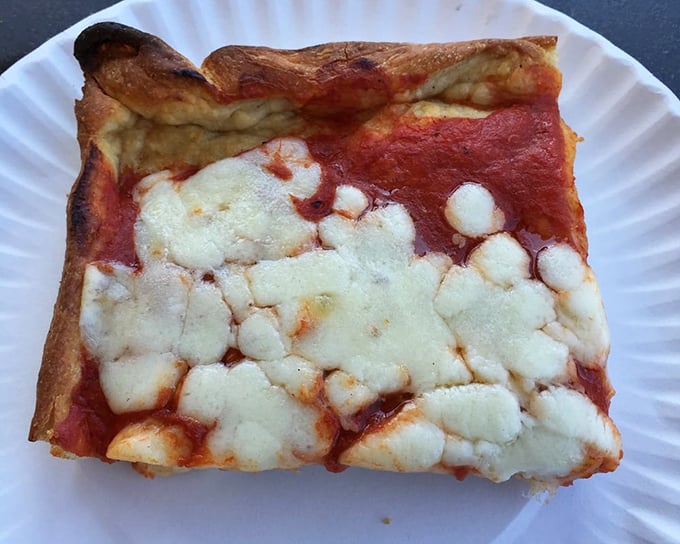 The square slice – a thick, pillowy base supporting a perfect ratio of sauce to cheese. Architectural integrity you can taste.