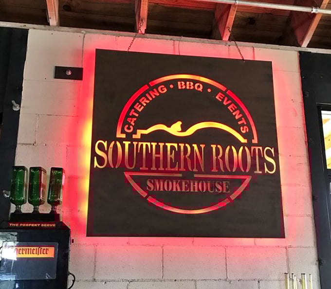 The glowing sign serves as both advertisement and promise. Like the bat signal, but for hungry people.