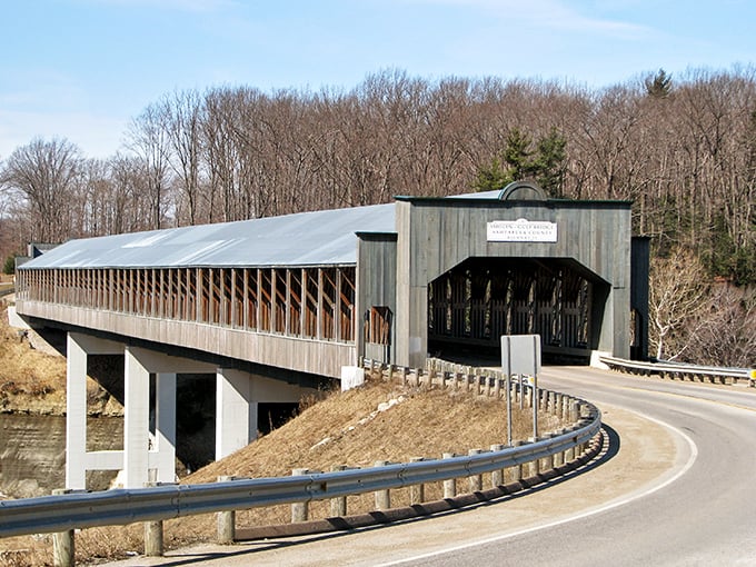 The Smolen-Gulf Covered Bridge stretches across the Ashtabula River like a wooden cathedral to transportation, sheltering travelers and memories alike.