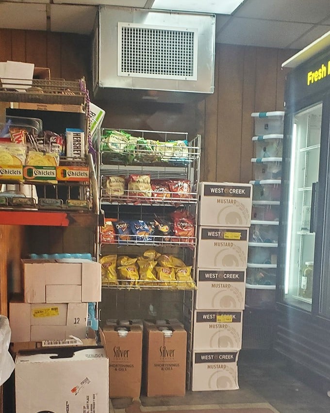 The grocery section reveals Mack's dual identity—part legendary burger joint, part neighborhood lifeline, with mustard stacked with the reverence it deserves.