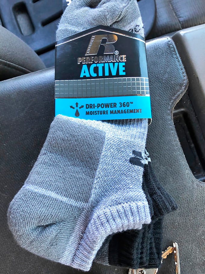 Brand new athletic socks with tags still attached—the holy grail of thrift finds. Someone's workout just got more comfortable without breaking the bank.