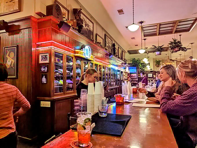 The warm glow behind the bar matches the friendly service—where your empty glass is noticed before you are.