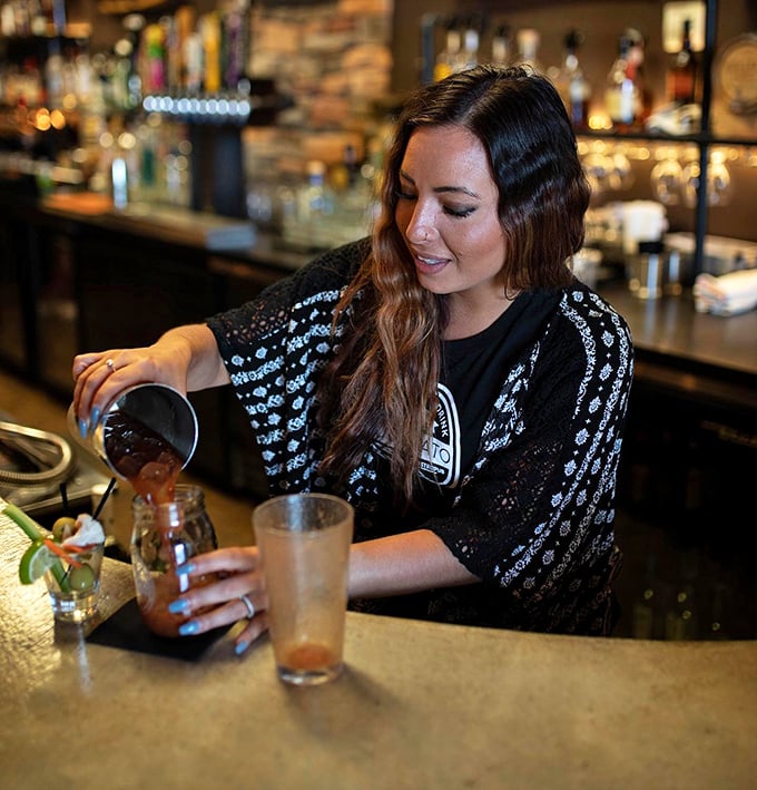 Behind every great meal stands someone who genuinely cares, mixing drinks and building the neighborhood vibe simultaneously.