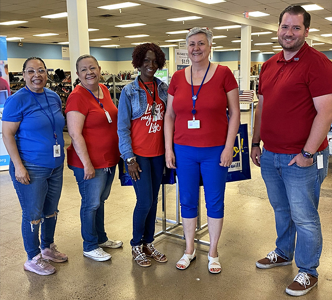 The friendly faces behind the bargains – Goodwill staff who transform donations into organized departments of possibility.