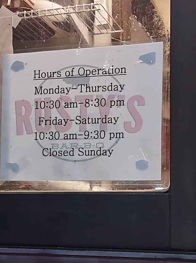 The hours sign tells you exactly when you can get your barbecue fix – plan accordingly or face the consequences of missing out.
