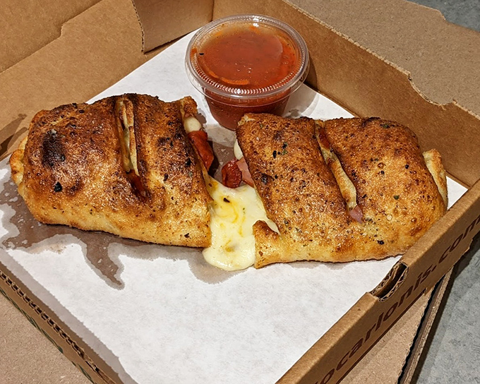 Stromboli that makes you wonder why you ever bothered with ordinary sandwiches – portable perfection with marinara on the side.