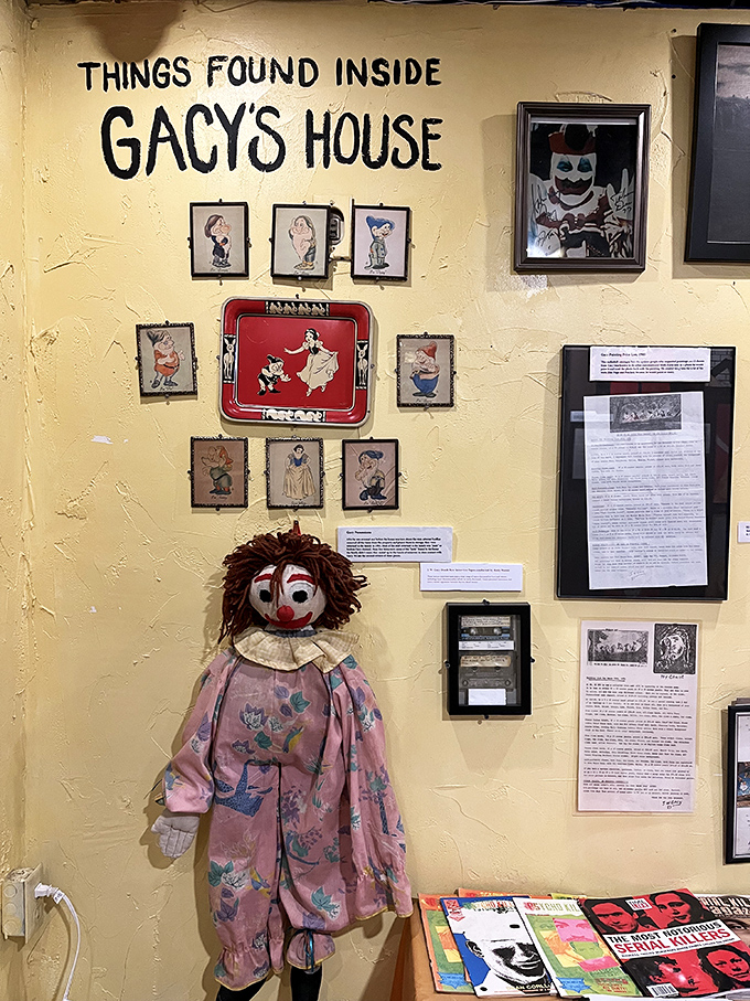 The John Wayne Gacy exhibit features disturbing artifacts from the killer clown's home, including his artwork depicting Snow White characters. Childhood innocence corrupted.