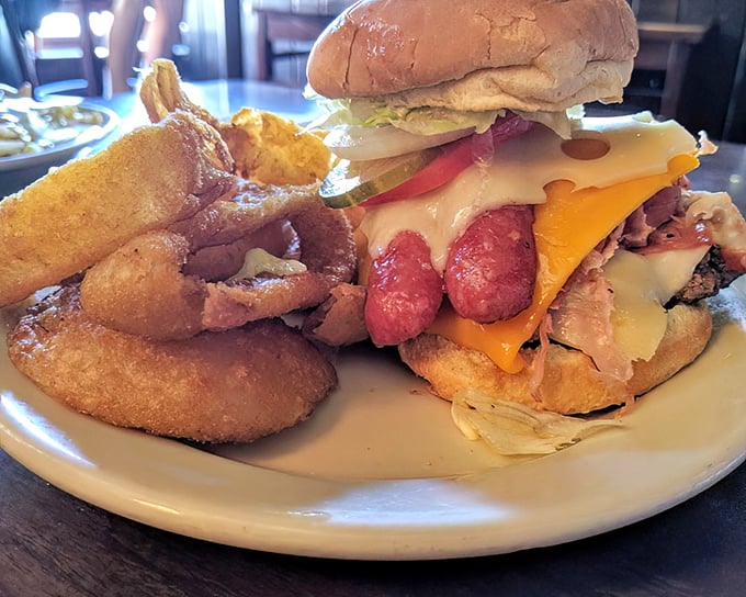 The legendary Train Wreck – a tower of burger, mettwurst, and cheese that requires both hands, several napkins, and absolutely no shame.