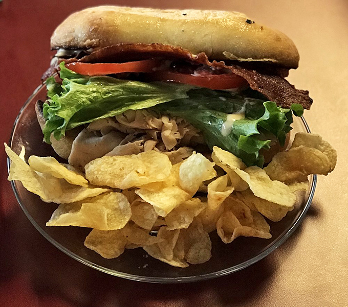Even the savory options demand attention—this turkey club sandwich with chips proves they're not just a one-trick pony.