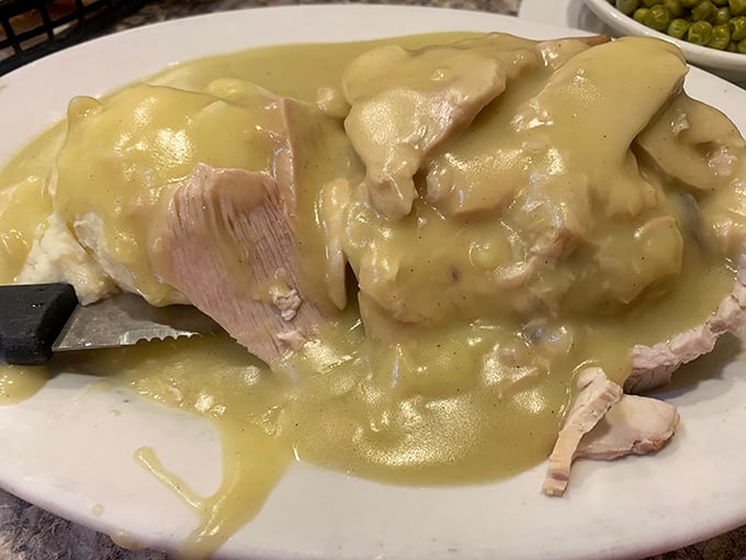 Turkey dinner with gravy cascading like a savory waterfall—Thanksgiving doesn't have to wait for November at Middlesex Diner.