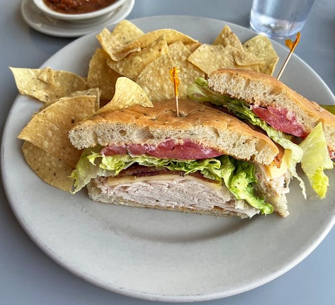 The club sandwich – not just stacked but architecturally sound, with crisp lettuce, juicy tomato, and turkey that wasn't just waved over a flame.
