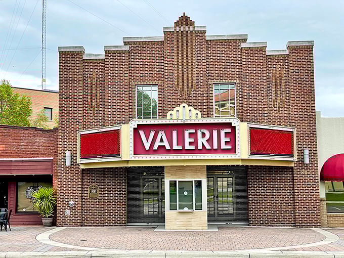 The Valerie Theatre's classic marquee glows with vintage charm – a reminder that entertainment doesn't require 3D glasses or subscription streaming services.