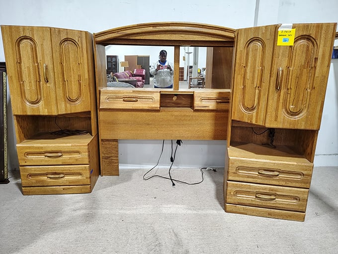This vintage vanity cabinet whispers tales of morning routines from decades past—solid wood craftsmanship that's outlasted three generations of flimsy furniture fads.
