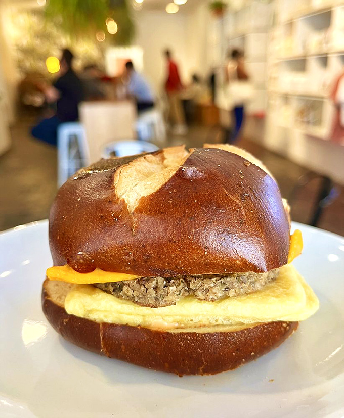 A pretzel bun breakfast sandwich that proves vegan food isn't about sacrifice. That golden exterior gives way to a satisfying, savory interior.