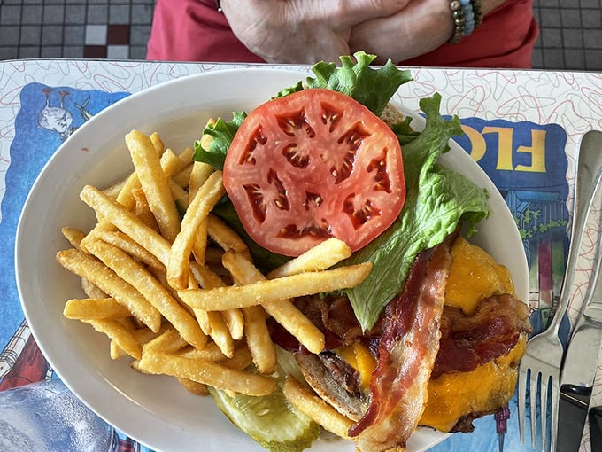 A burger that belongs on the cover of "Burger Monthly" – if such a magazine existed, this photogenic stack of beef, bacon and cheese would have a subscription.