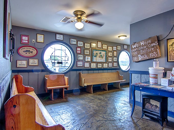 The waiting area's porthole windows and wooden benches set the stage for what's to come—a dining experience that honors Arkansas's waterways.
