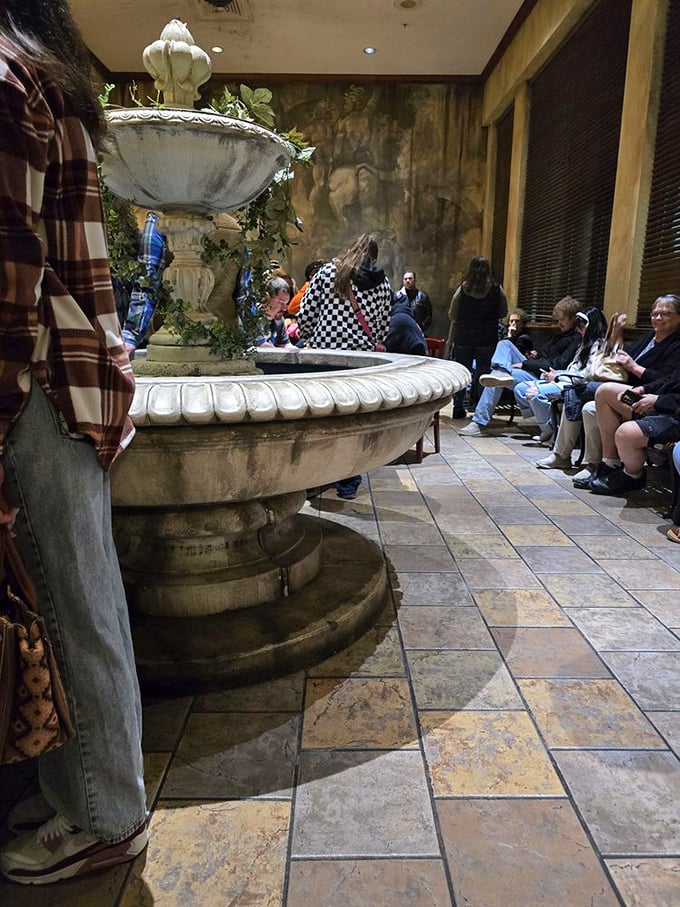 The waiting area's fountain creates a moment of Zen before the culinary storm. Italian patience is rewarded with Italian portions.