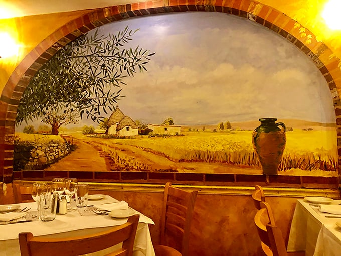 The mural doesn't just depict the Italian countryside – it's a window to another world where olive trees sway and pasta is always perfectly al dente.
