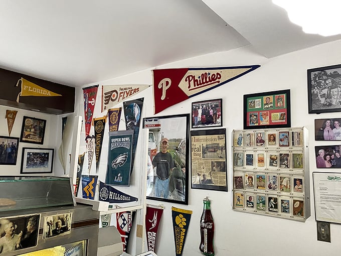 The walls serve as a community scrapbook—sports pennants, local memorabilia, and photographs chronicle decades of Goshen history and American pastimes.