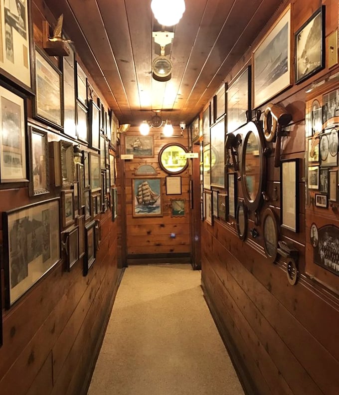 This hallway gallery showcases decades of maritime history, making every trip to the restroom educational.