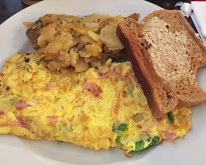The Western omelet and home fries combo – a breakfast classic executed with the precision of a short-order cook who's seen it all.