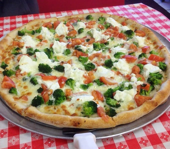 This white pizza with broccoli and tomatoes proves vegetables on pizza aren't just virtuous—they're downright decadent when paired with the right cheese and crust.