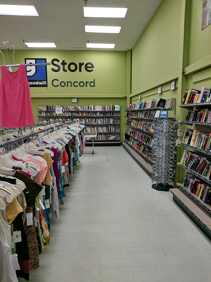 The Goodwill Store Concord sign watches over a sea of women's tops—each hanger a tiny lifeboat carrying fashion from one closet to its next adventure.