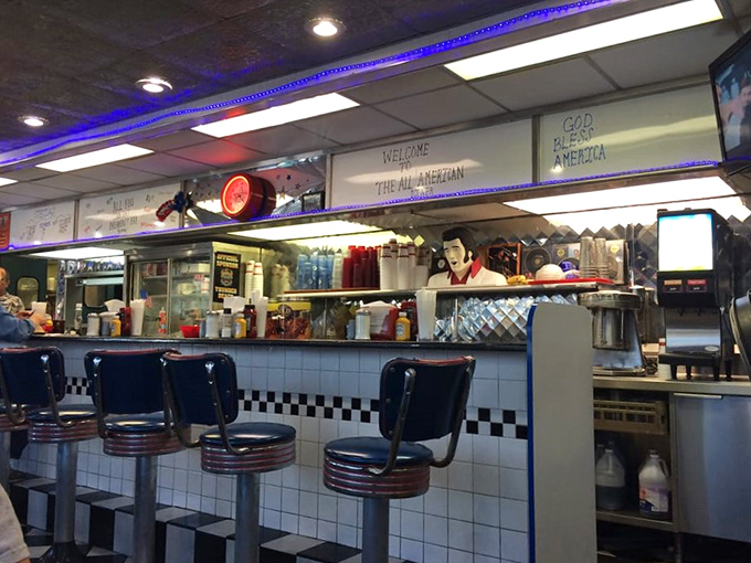 "Welcome to the All American"—where neon signs and friendly greetings make you feel instantly at home.