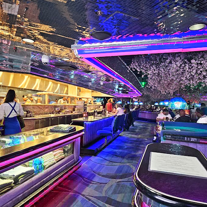 The Fireside Lounge's mirrored ceiling and neon glow create a dreamscape where cocktails flow and time stands deliciously still.