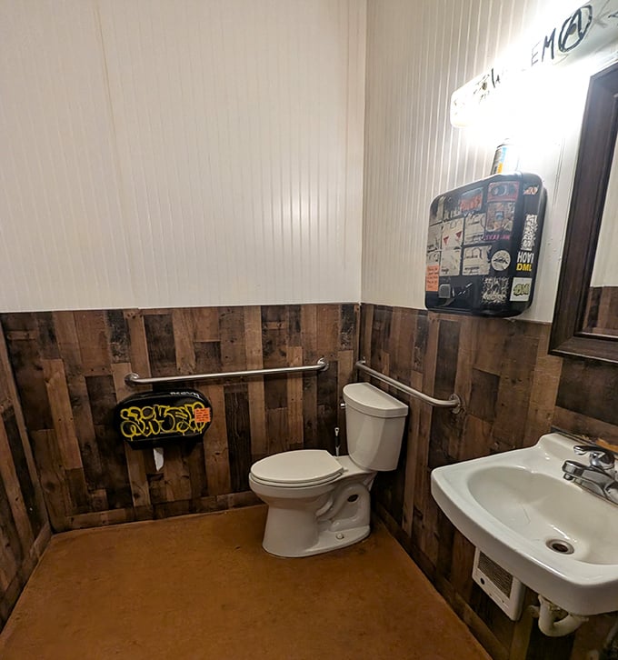 Even the bathroom gets the Shakabrah treatment—rustic wood paneling and quirky details maintain the joint's unpretentious character.