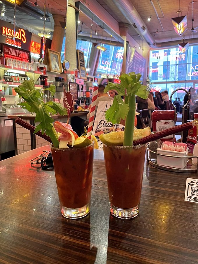 Bloody Marys garnished with celery stalks standing at attention—liquid salad that makes day drinking seem downright virtuous.