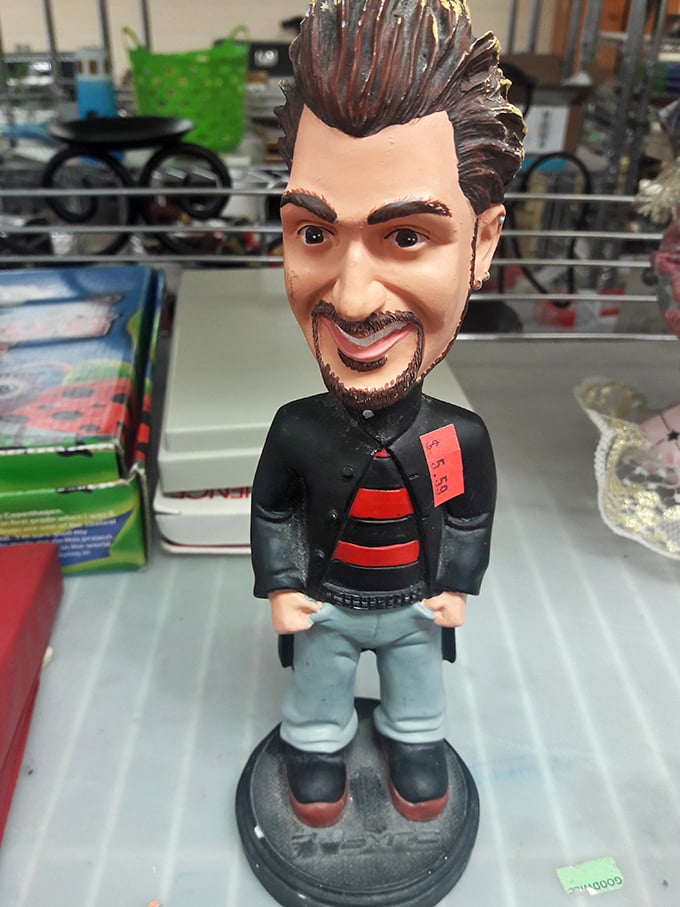 A bobblehead figure stands guard among the collectibles – proof that one person's quirky is another's treasure.