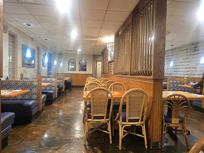 The dining room's warm wood tones and rattan chairs create an atmosphere that's part coastal cantina, part family dining room—comfortable in either role.