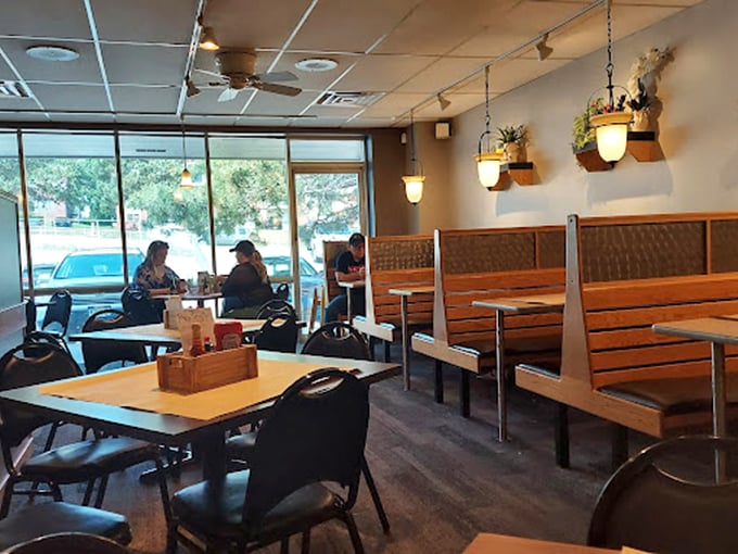 Wooden booths bathed in natural light create that perfect neighborhood restaurant vibe—familiar enough for regulars, welcoming enough for first-timers.