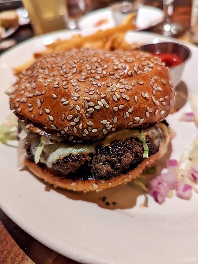 A burger that demands to be photographed before eaten—sesame-studded bun, perfectly charred patty, and toppings arranged with architectural precision.