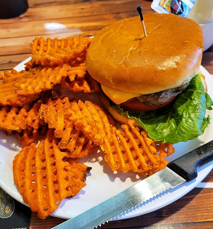 This burger isn't trying to reinvent the wheel—it's just perfecting it. Juicy, perfectly proportioned, and those waffle fries deserve their own fan club.